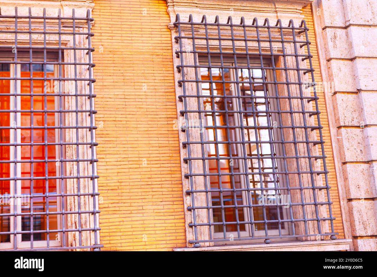 Windows with bars on them and red brick wall Stock Photo - Alamy
