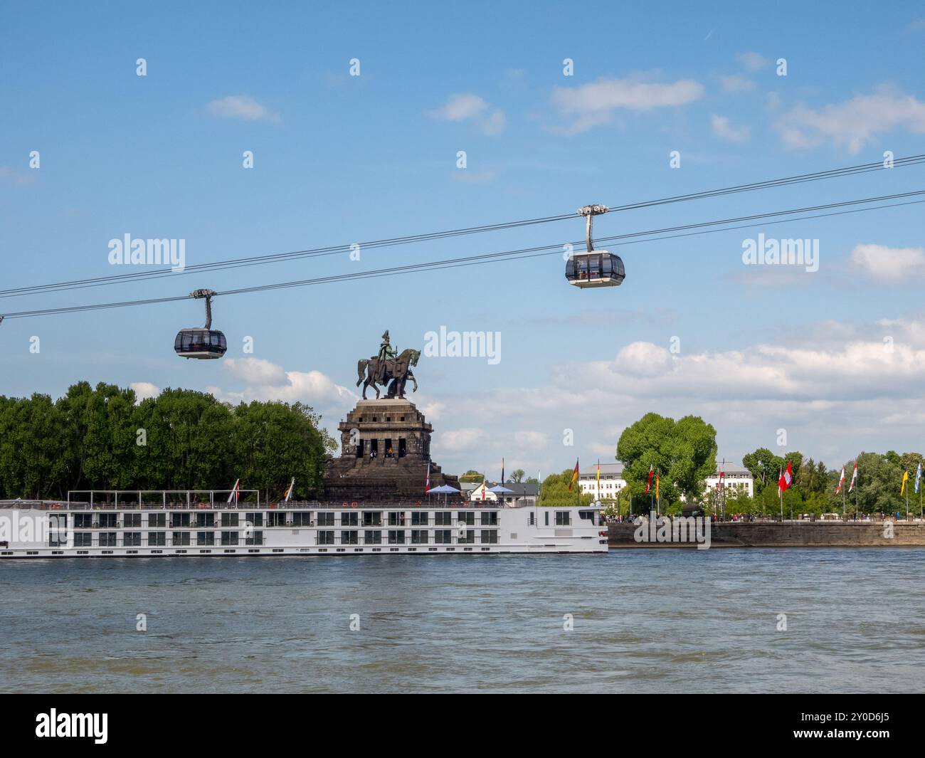 Cable cars travel across the Rhine River in Koblenz, Germany, offering ...
