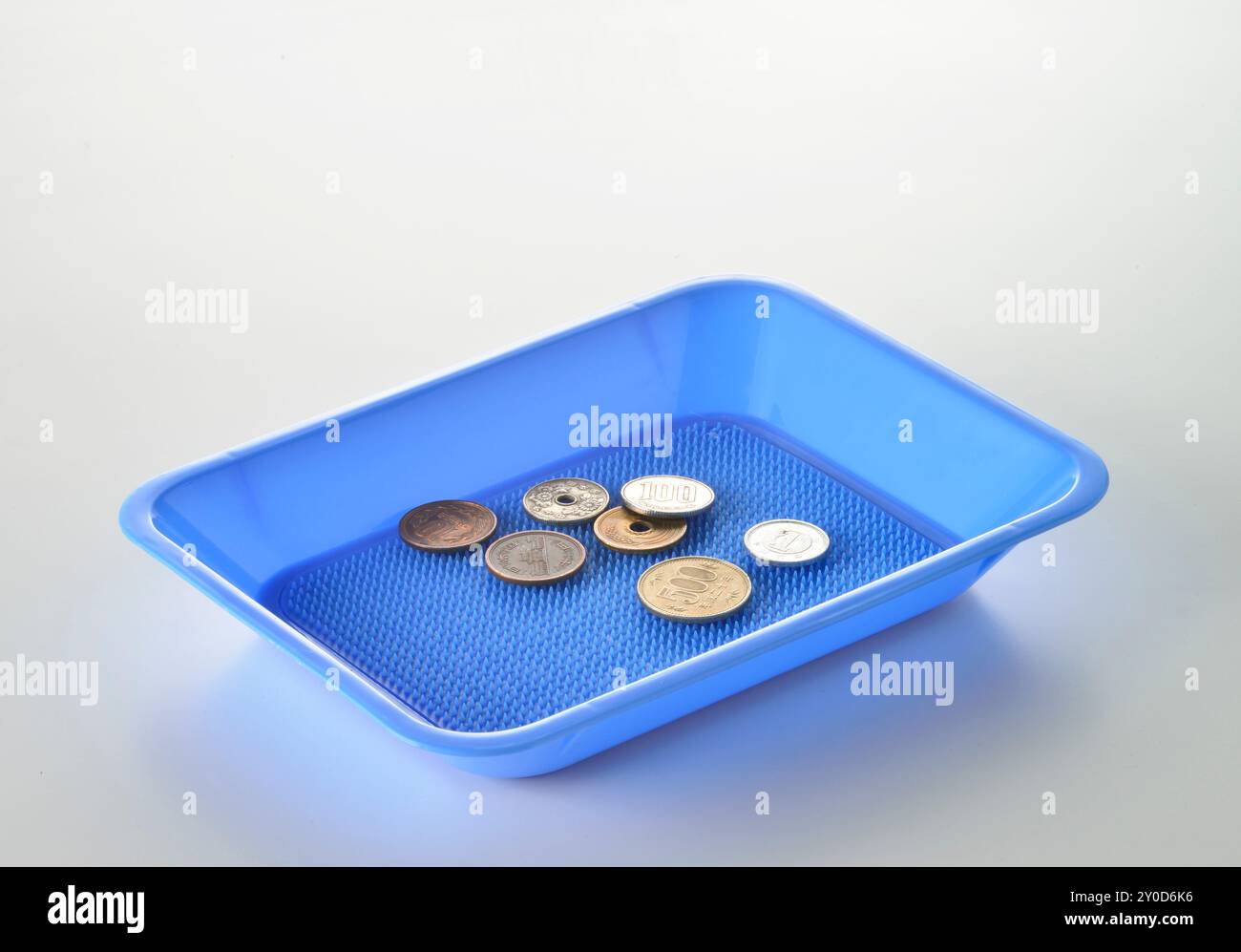 Change tray with a white background Stock Photo - Alamy