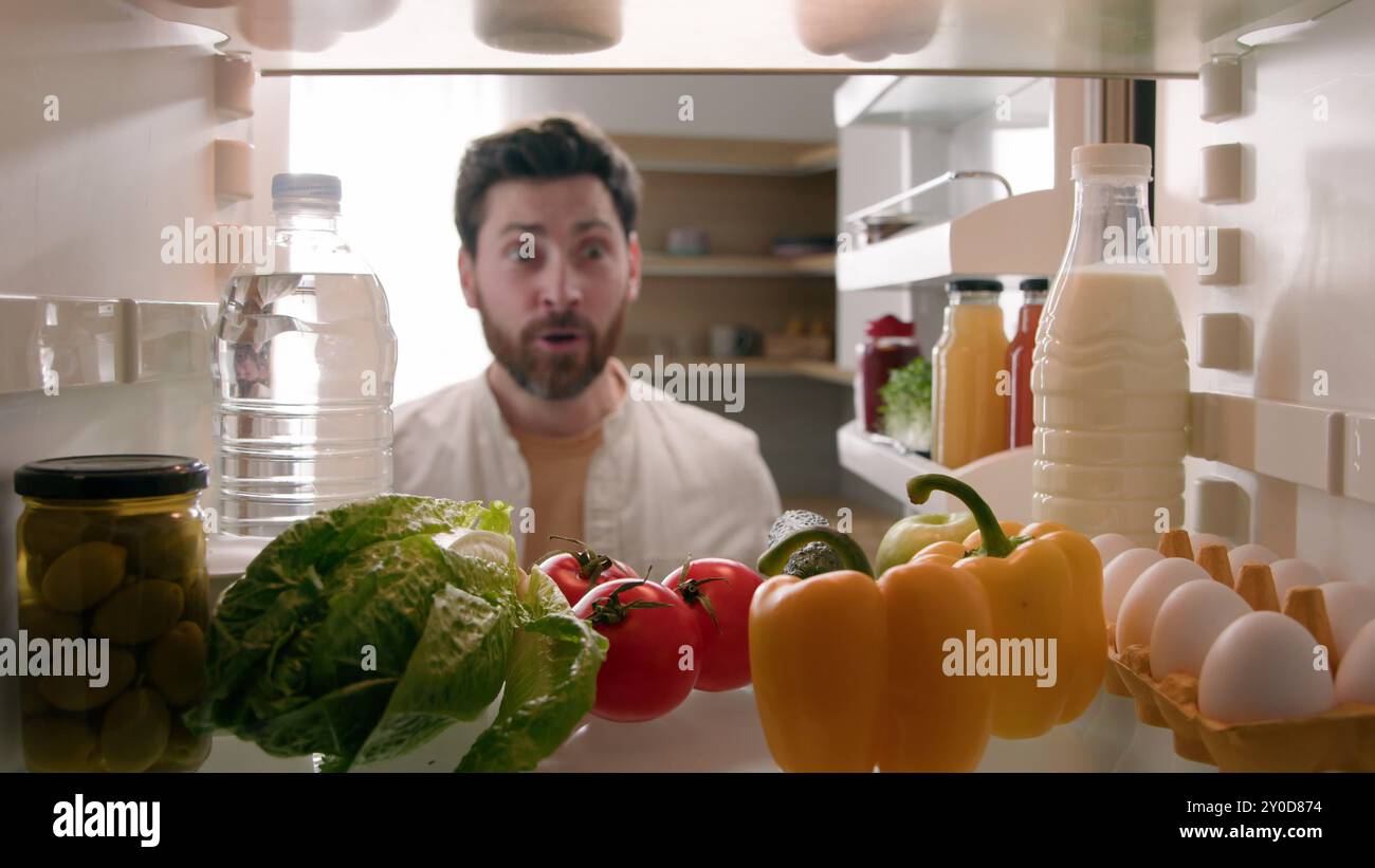 POV point of view from inside refrigerator Caucasian happy funny man ...