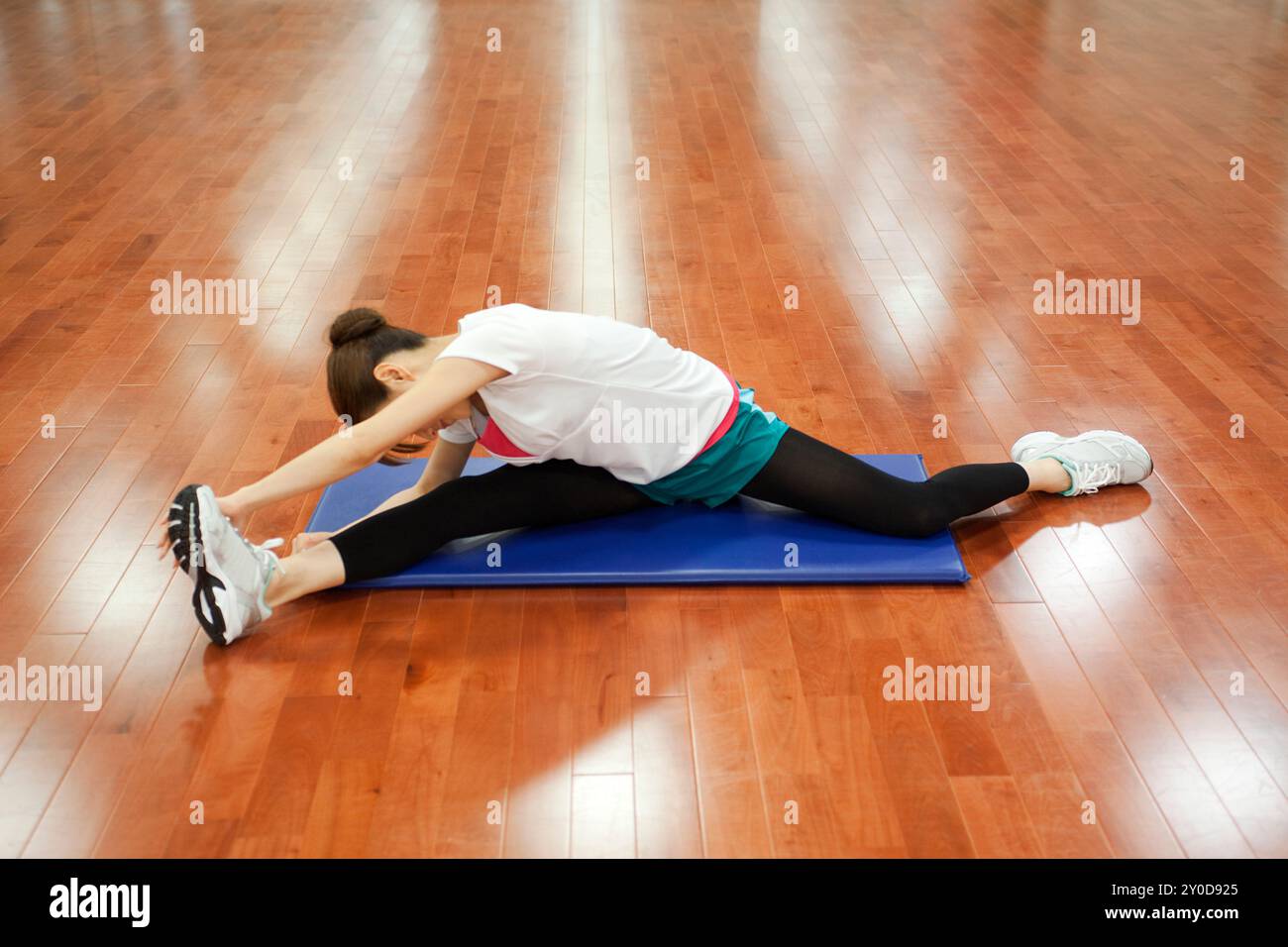a stretching woman Stock Photo - Alamy
