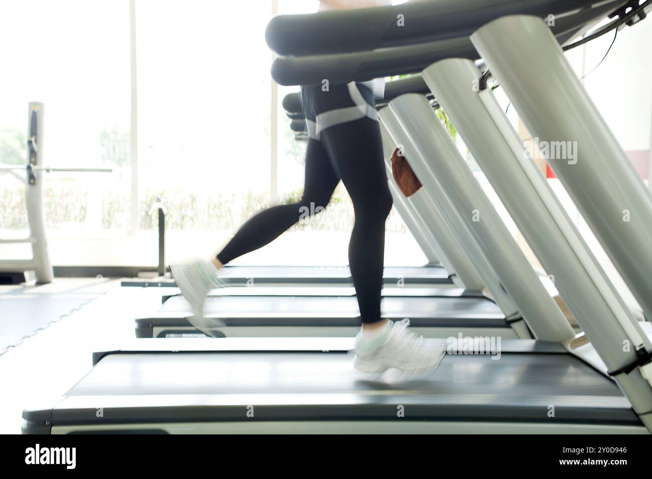 Feet of a woman exercising on a treadmill Stock Photo - Alamy
