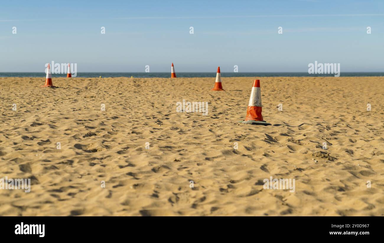 Pylons on the beach, seen in Aberporth Bay, Ceredigion, Dyfed, Wales ...