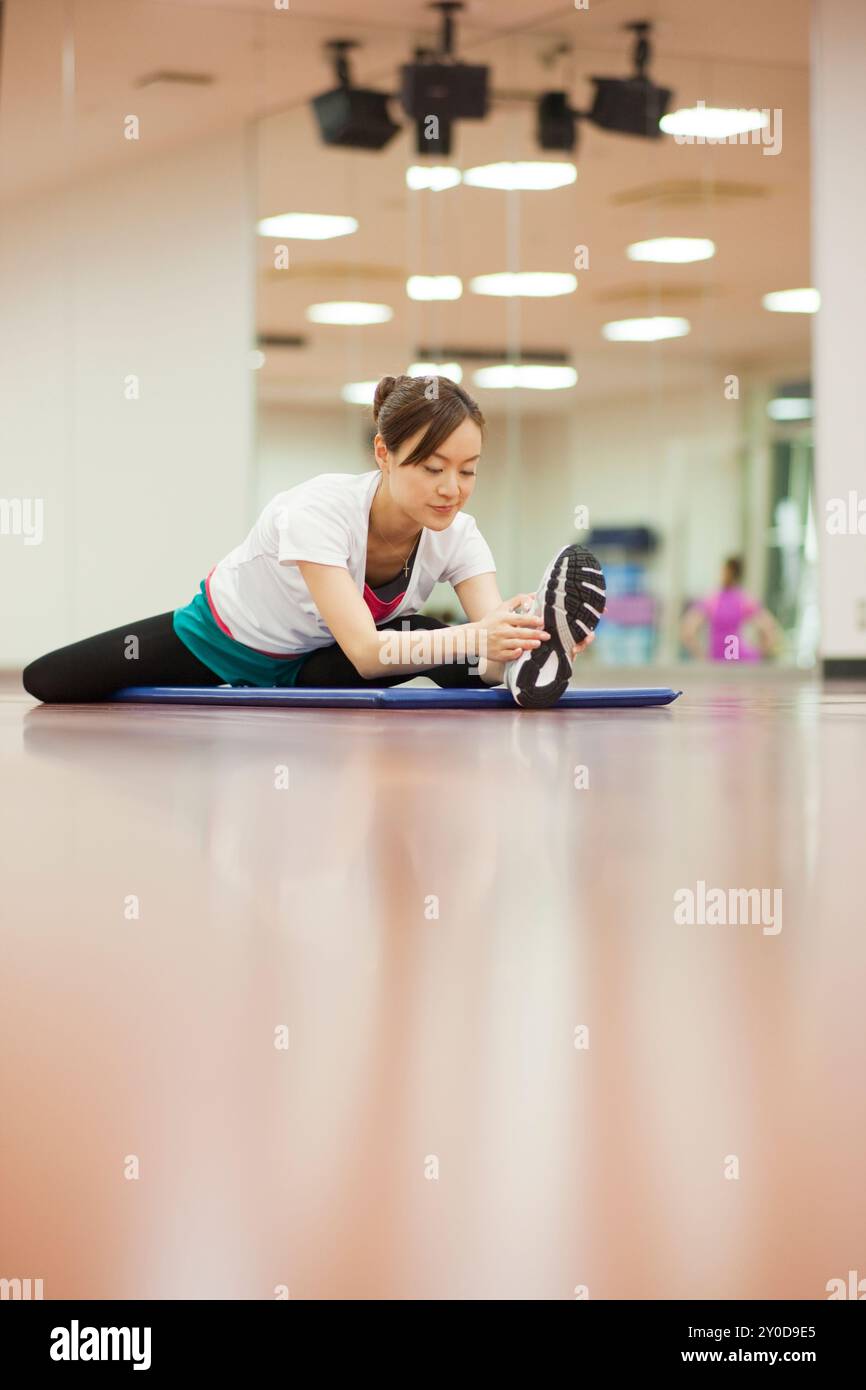 a stretching woman Stock Photo - Alamy