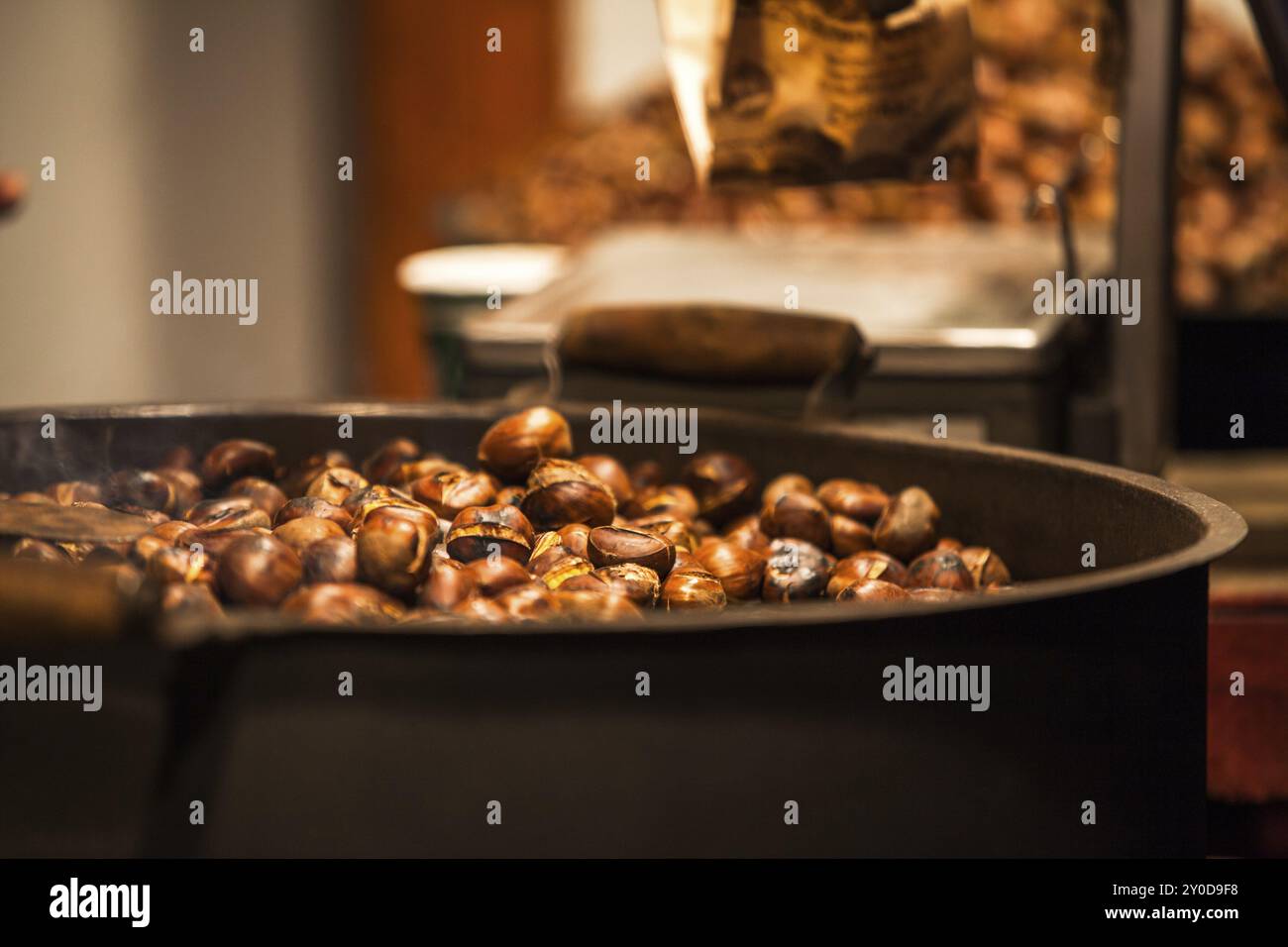 Roasted chestnuts at a Christmas market Stock Photo - Alamy
