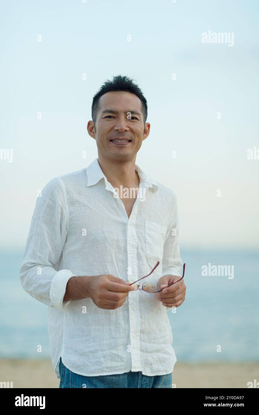 A Japanese man smiling Stock Photo - Alamy