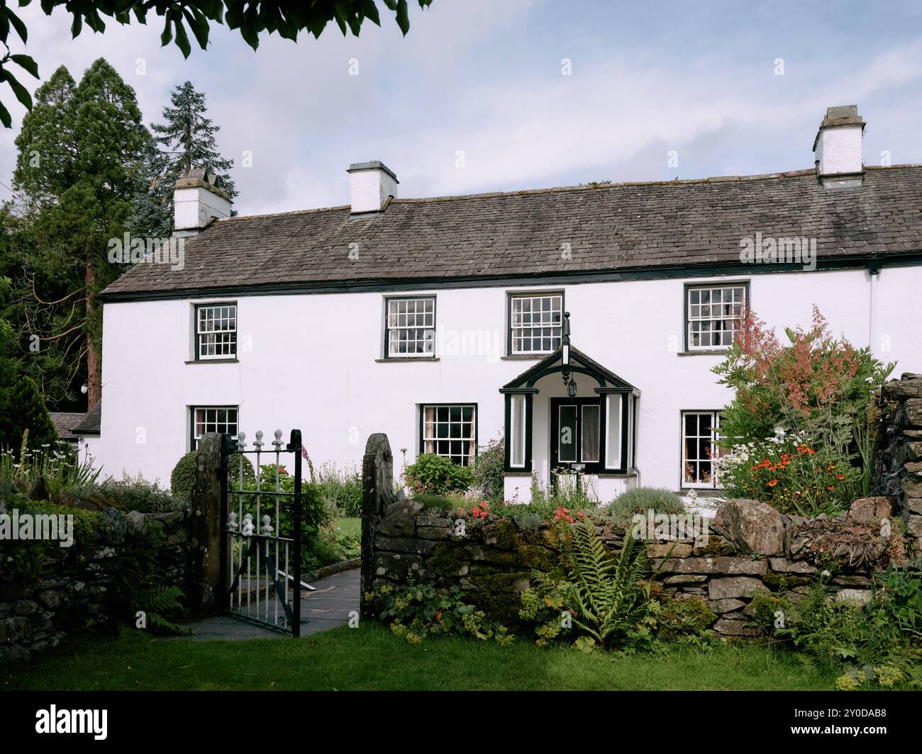 Typical Lake District white terraced cottage architecture in Near ...
