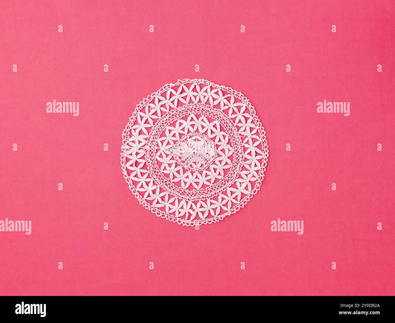 Doily lace and pink cotton cloth Stock Photo - Alamy
