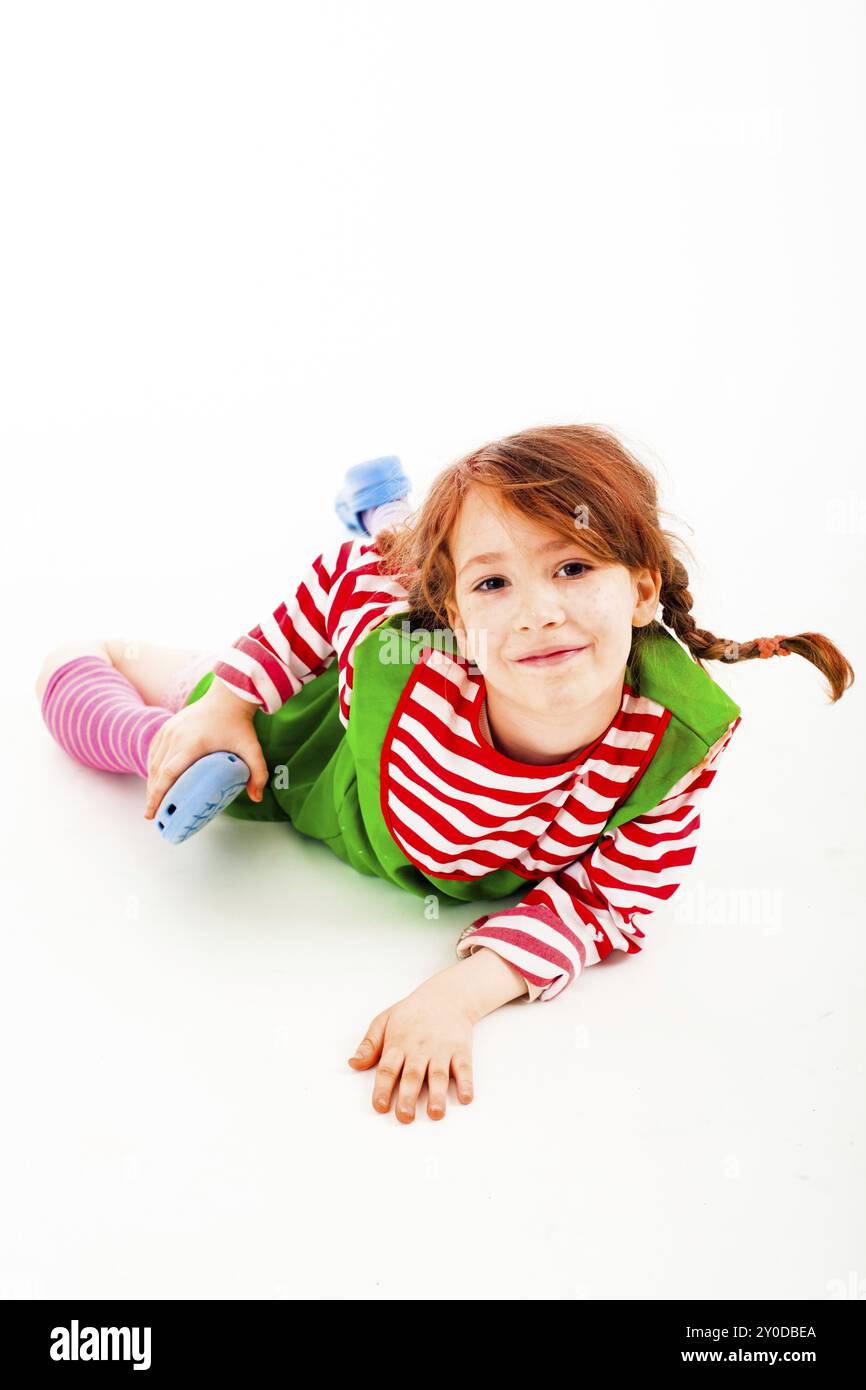 Little girl dressed as Pippi Longstocking with white background Stock ...
