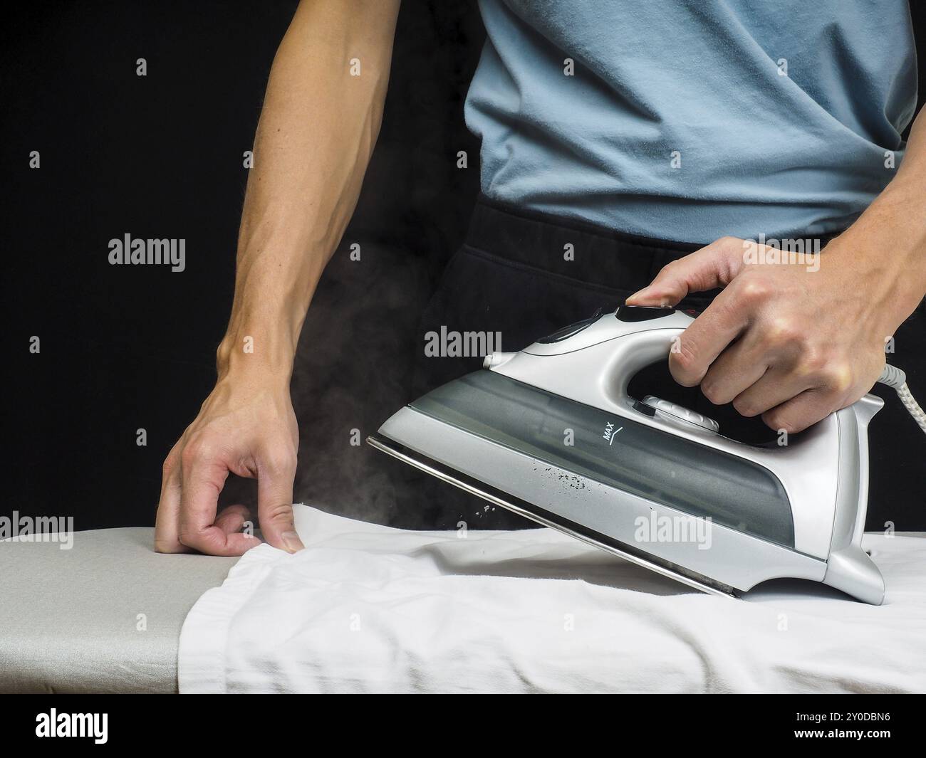 Male ironing housework one person hi-res stock photography and images ...