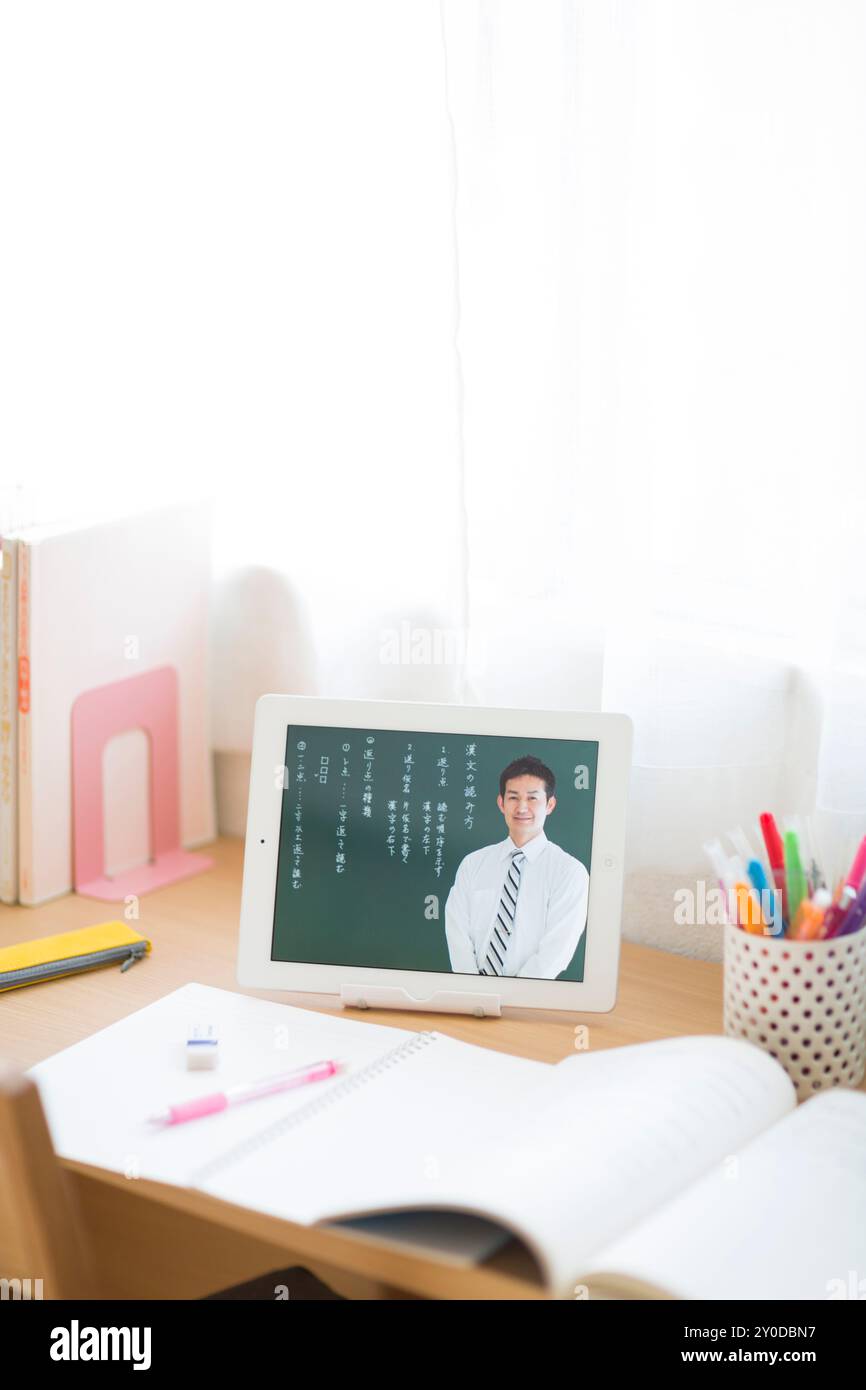Desk of middle or high school student using a tablet Stock Photo - Alamy