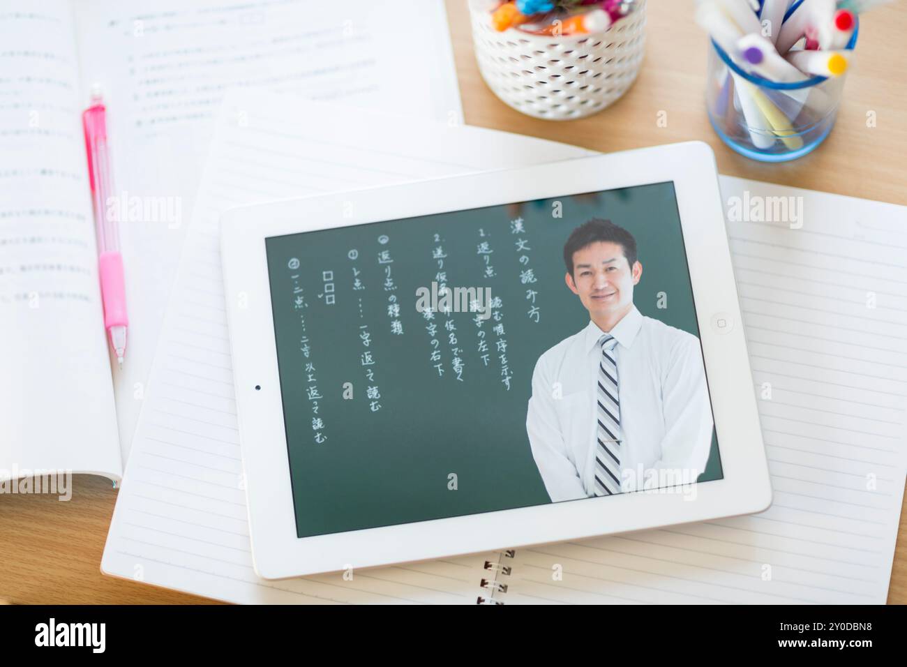 Desk of middle or high school student using a tablet Stock Photo - Alamy