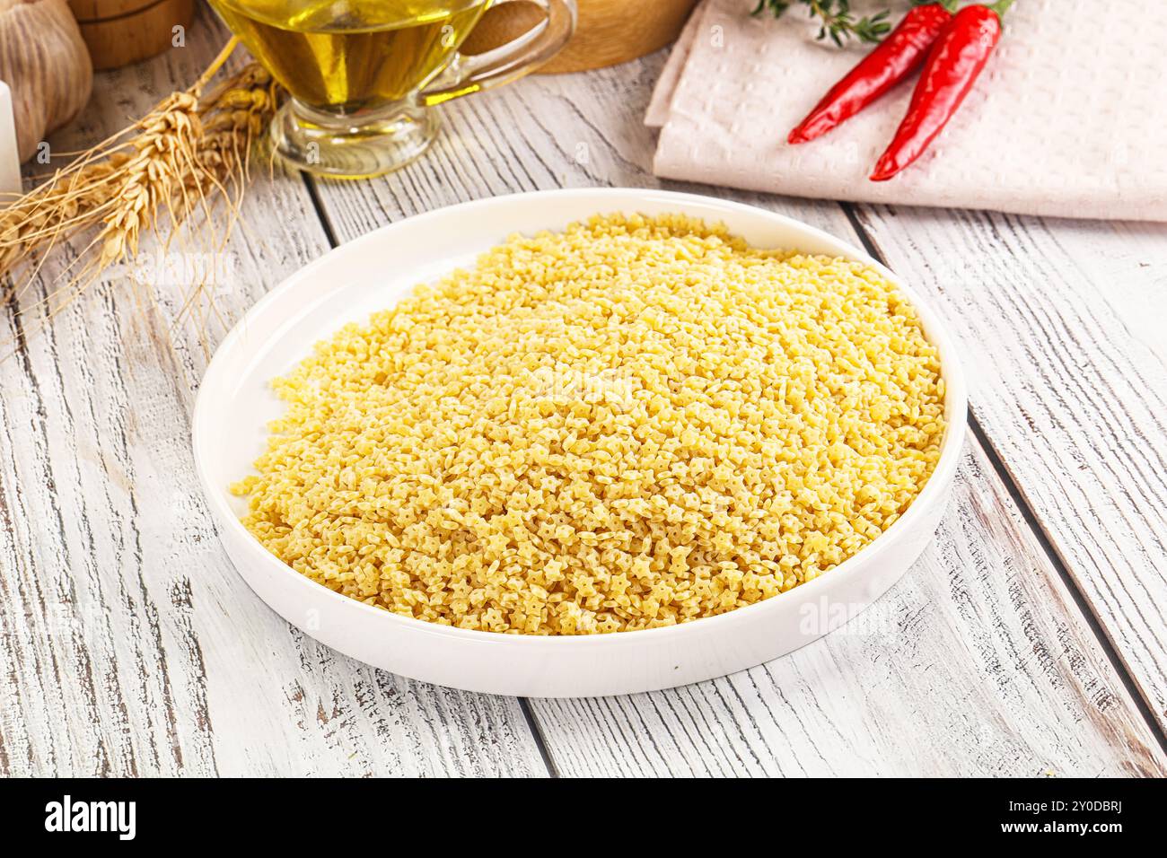 Italian cuisine - dry stelline pasta for bowl Stock Photo - Alamy