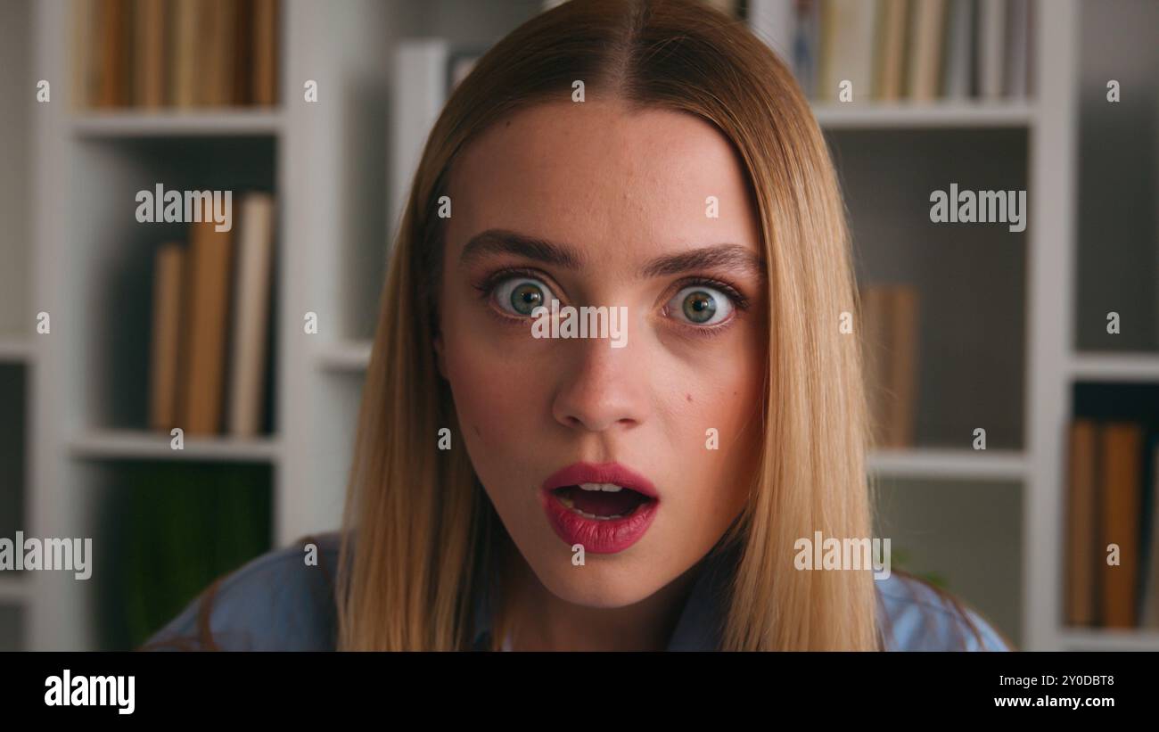 Close up headshot shocked afraid amazed wonder astonish female face big ...