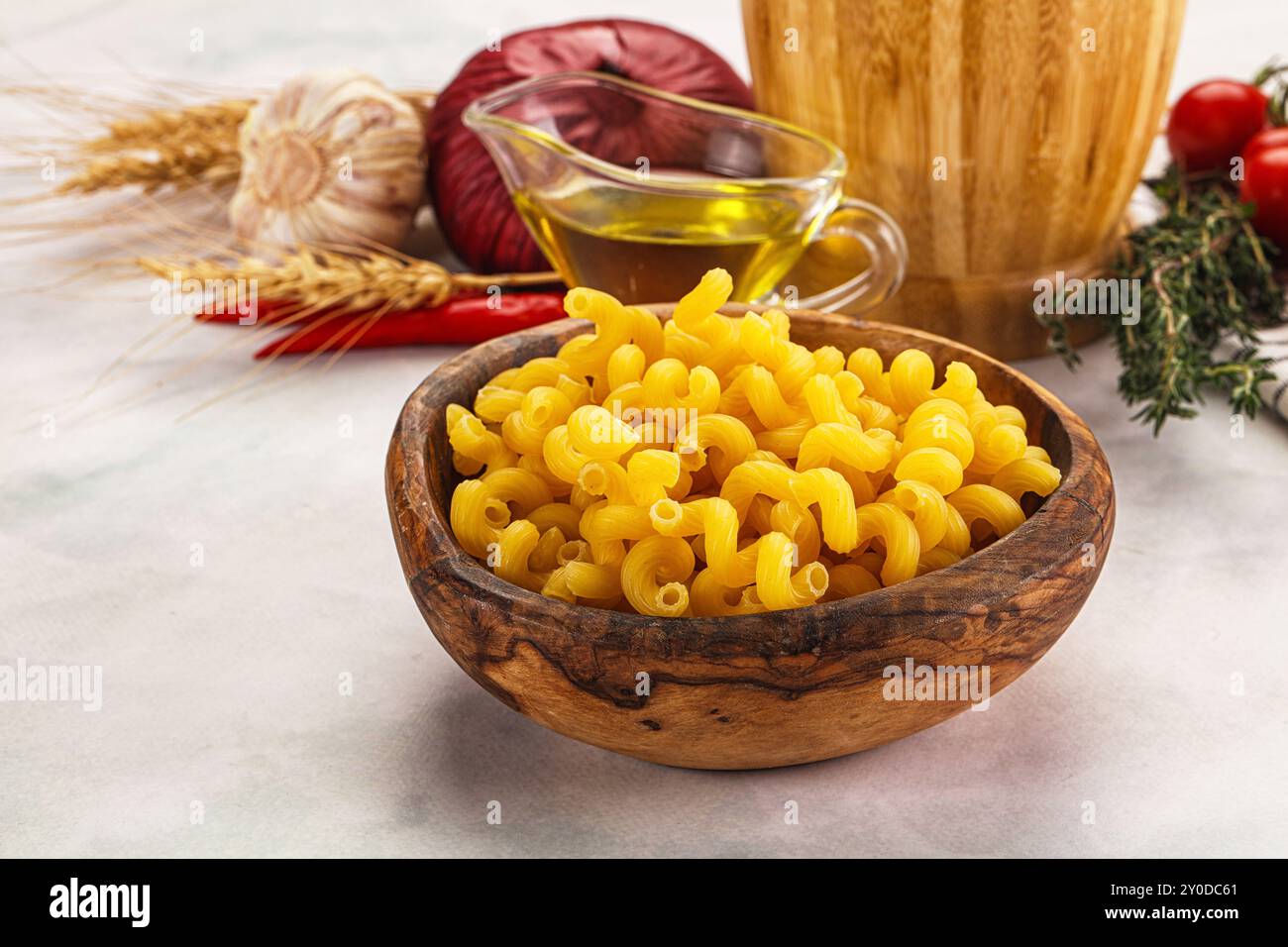 Italian cuisine - dry cellentani pasta for cooking Stock Photo - Alamy