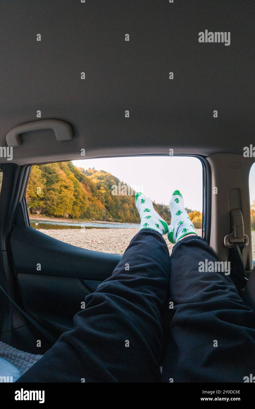 Relaxing in a Car with Legs Out the Window Road Trip Stock Photo - Alamy