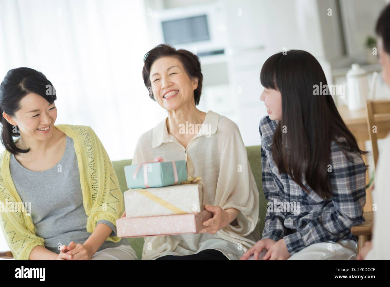 Delighted grand mother to receive presents Stock Photo - Alamy