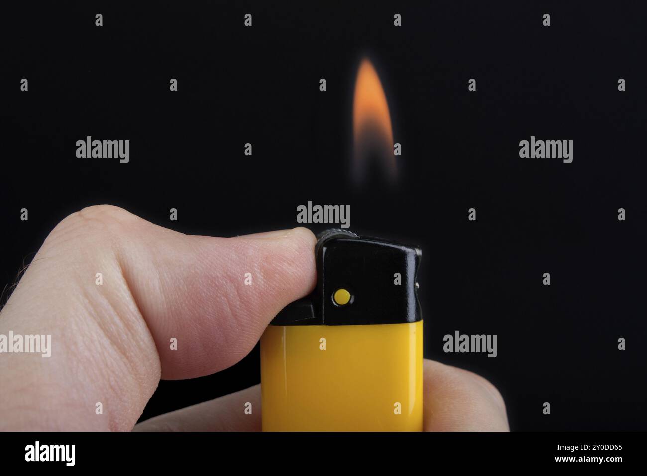 Smoking cigarette gas lighter burning fire flame Stock Photo - Alamy