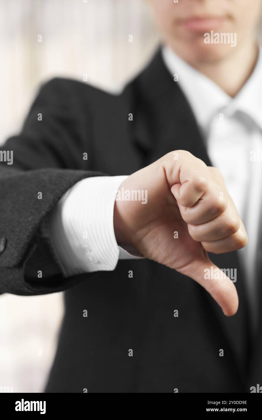 Business women hand gesture thumb down failure sign Stock Photo - Alamy