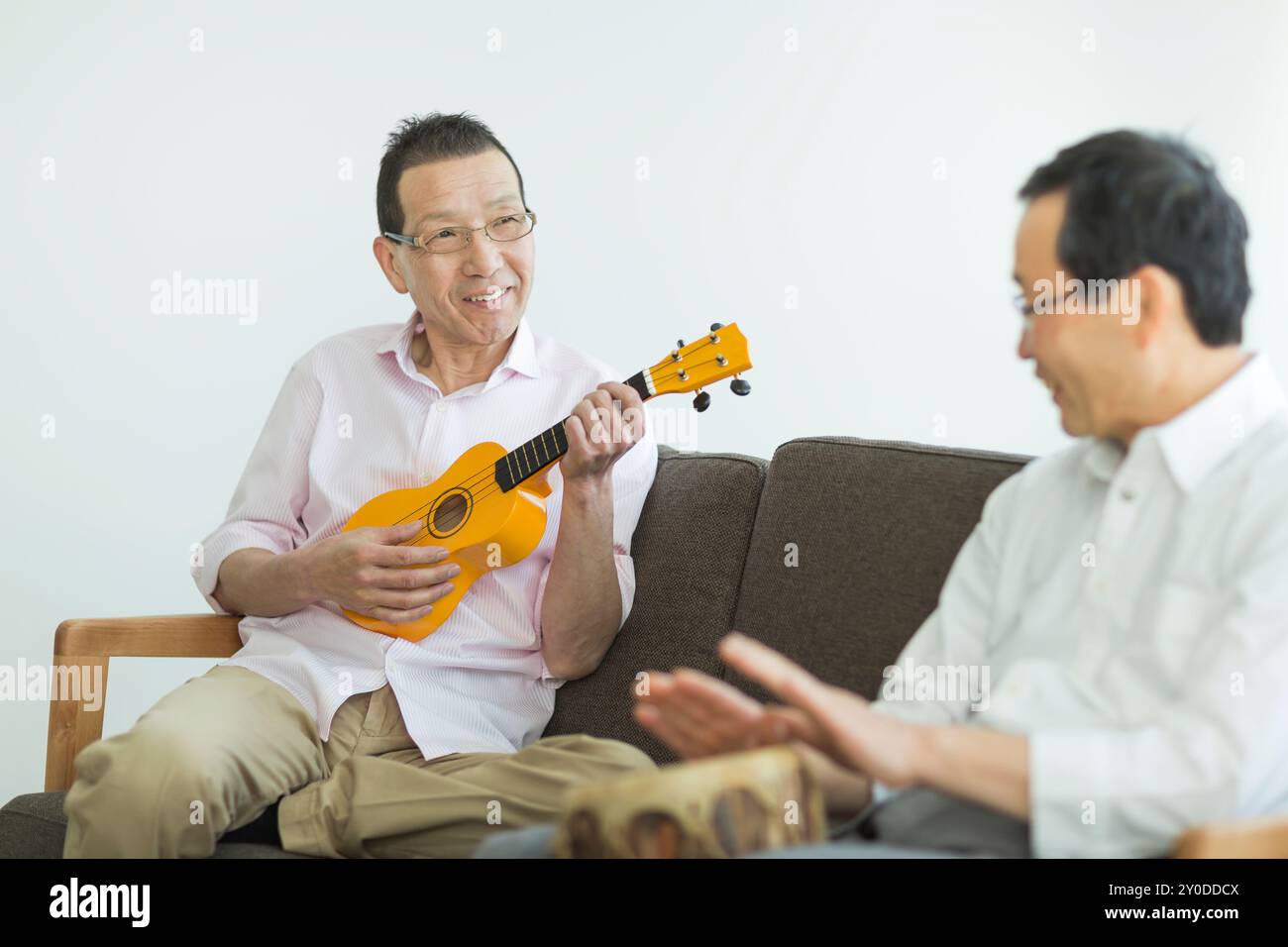 An elderly man playing an instrument Stock Photo - Alamy
