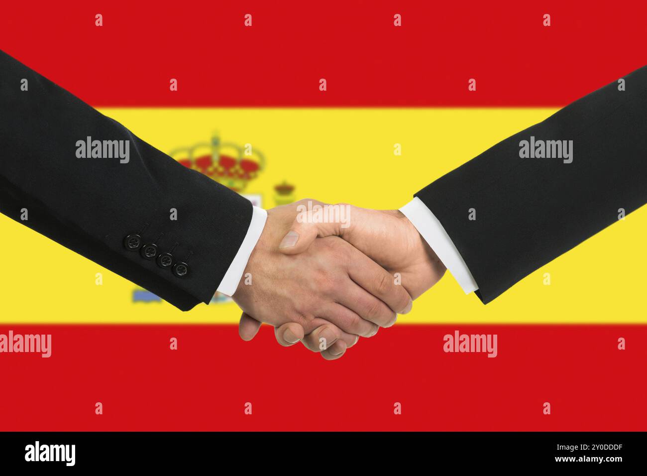 The Spanish flag and business handshake Stock Photo - Alamy