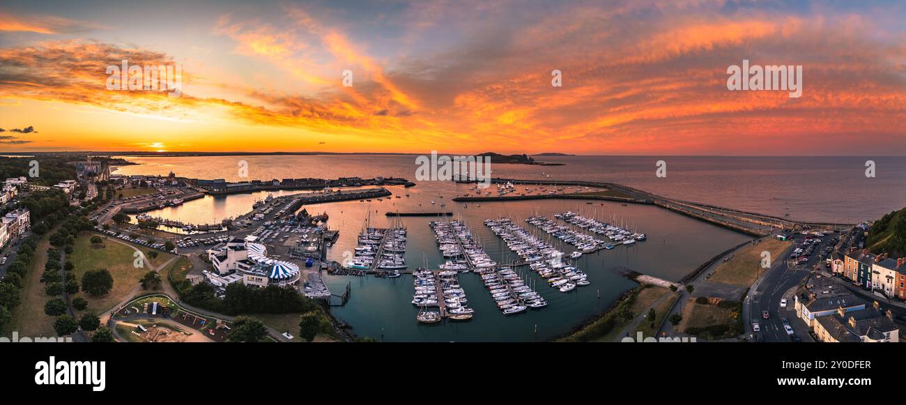 Panorama of a fiery sunset sky over Howth Harbour Stock Photo - Alamy