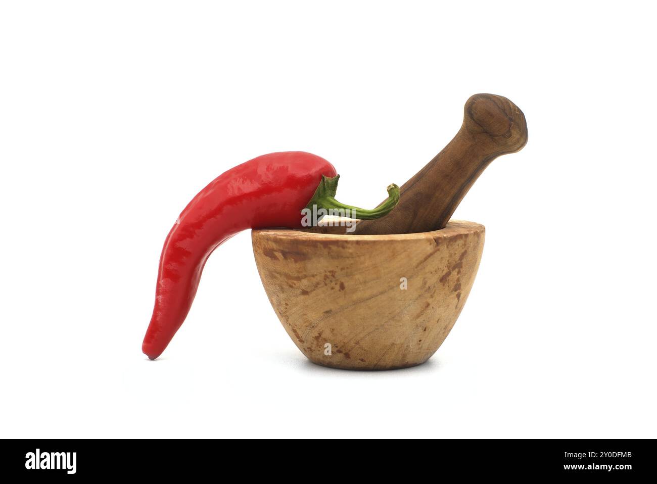 Fresh red chili pepper and old rustic wooden pestle with mortar ...