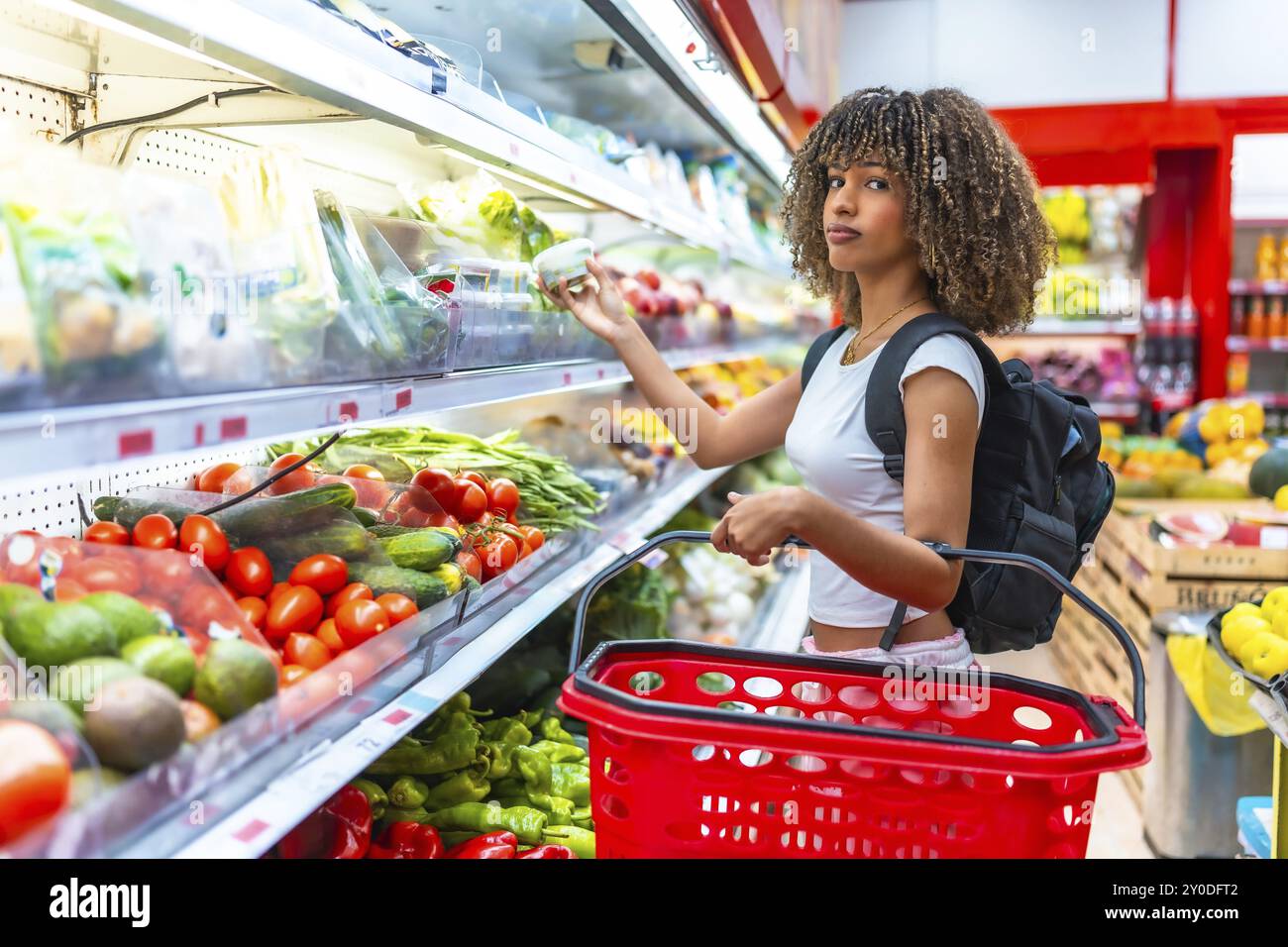 Latin curious beauty woman shopping fresh food in the supermarket in ...