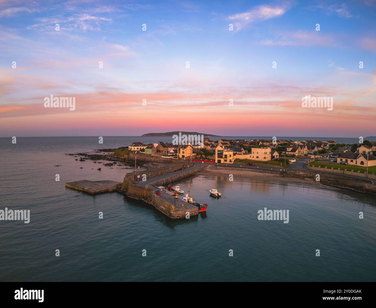 Post sunset sky facing east with the moon up over Rush Harbour Stock ...