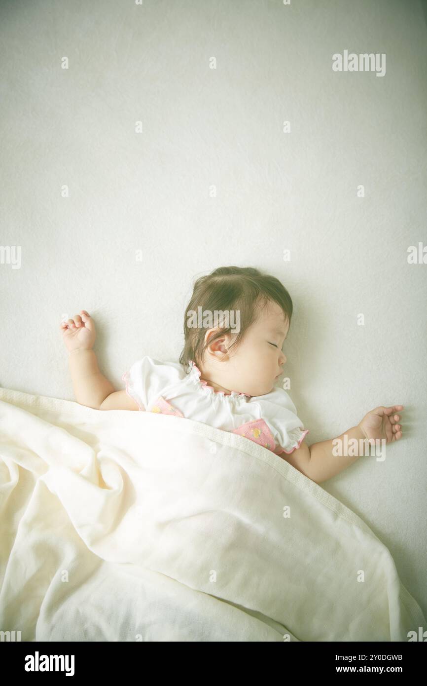 Baby taking a nap Stock Photo - Alamy