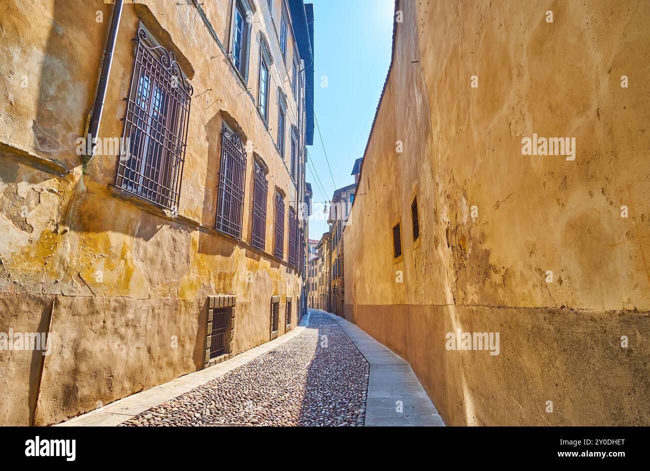 The narrow curved Via Arena with Santa Grata Church and Donizetti ...