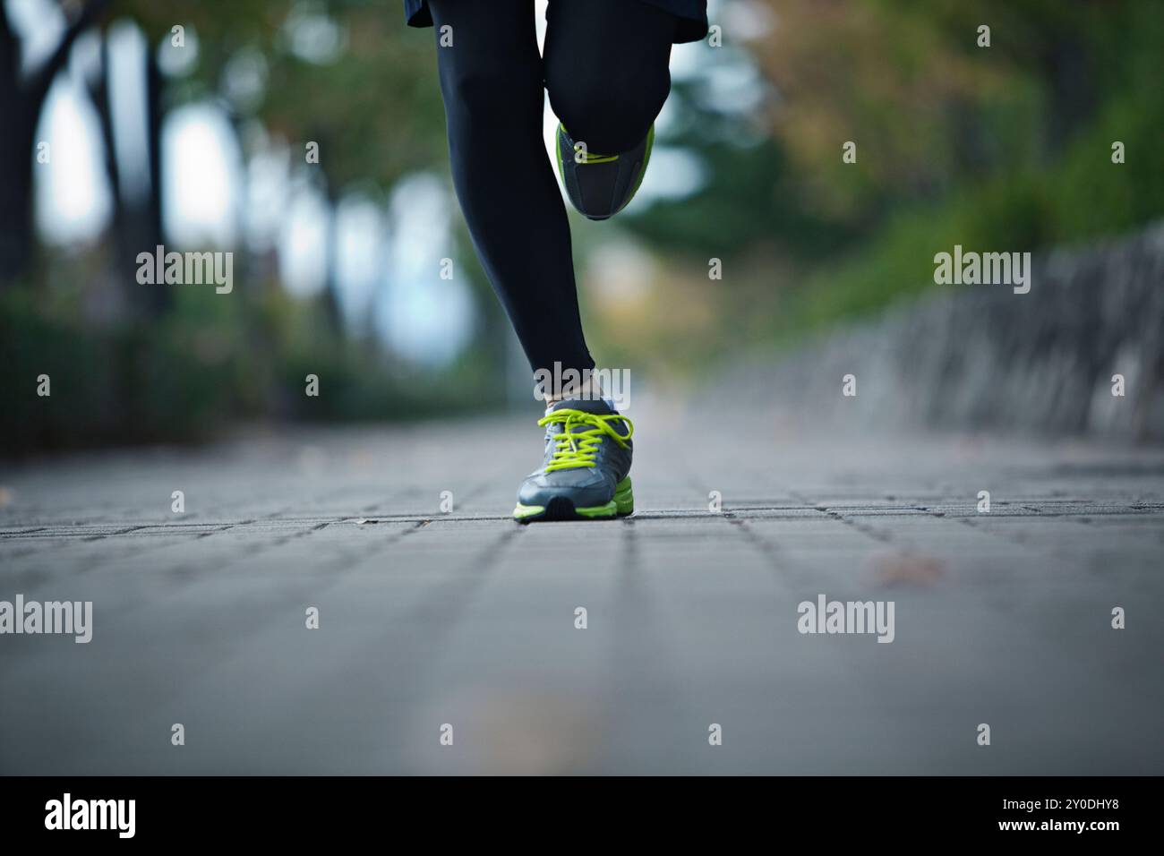 Feet of a running man Stock Photo - Alamy