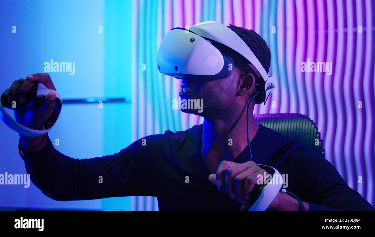 3d gaming African man male guy play controllers VR helmet virtual ...