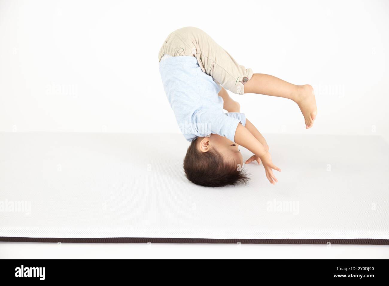 Children rolling forward Stock Photo - Alamy