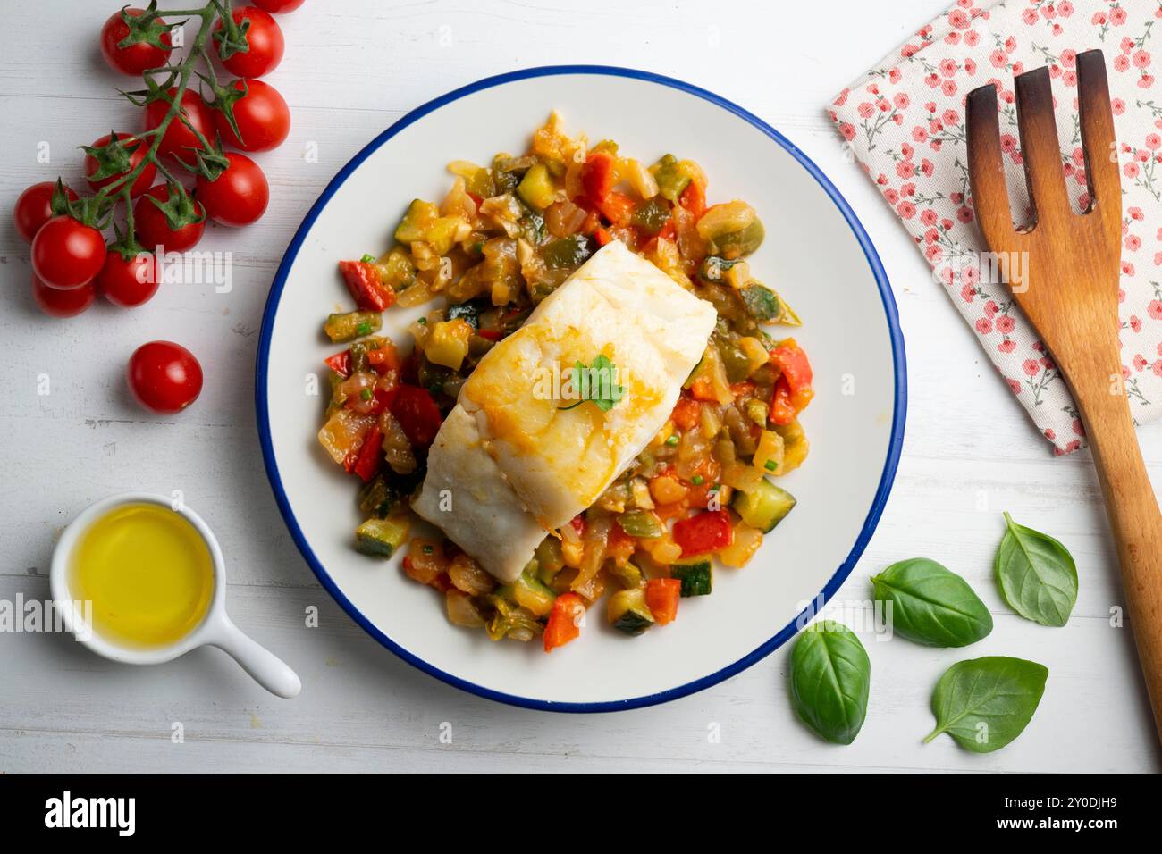 Cod with baked vegetables traditional Spanish recipe. Top view food ...