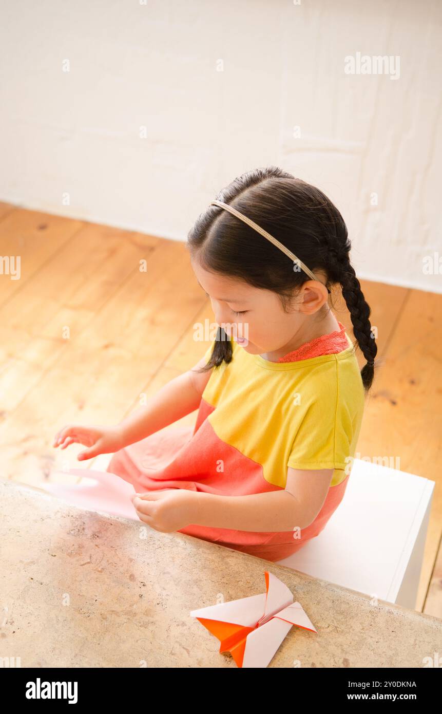 A girl cutting paper Stock Photo - Alamy