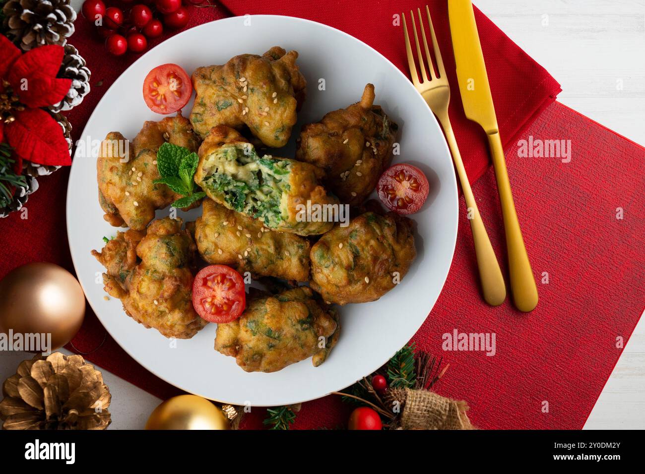Spinach fritters, traditional Spanish tapa. Top view table with ...