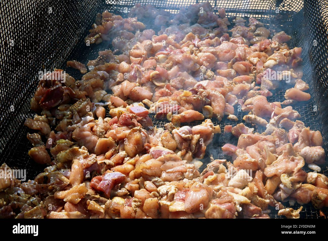 Free range chicken being charcoal grilled Stock Photo - Alamy