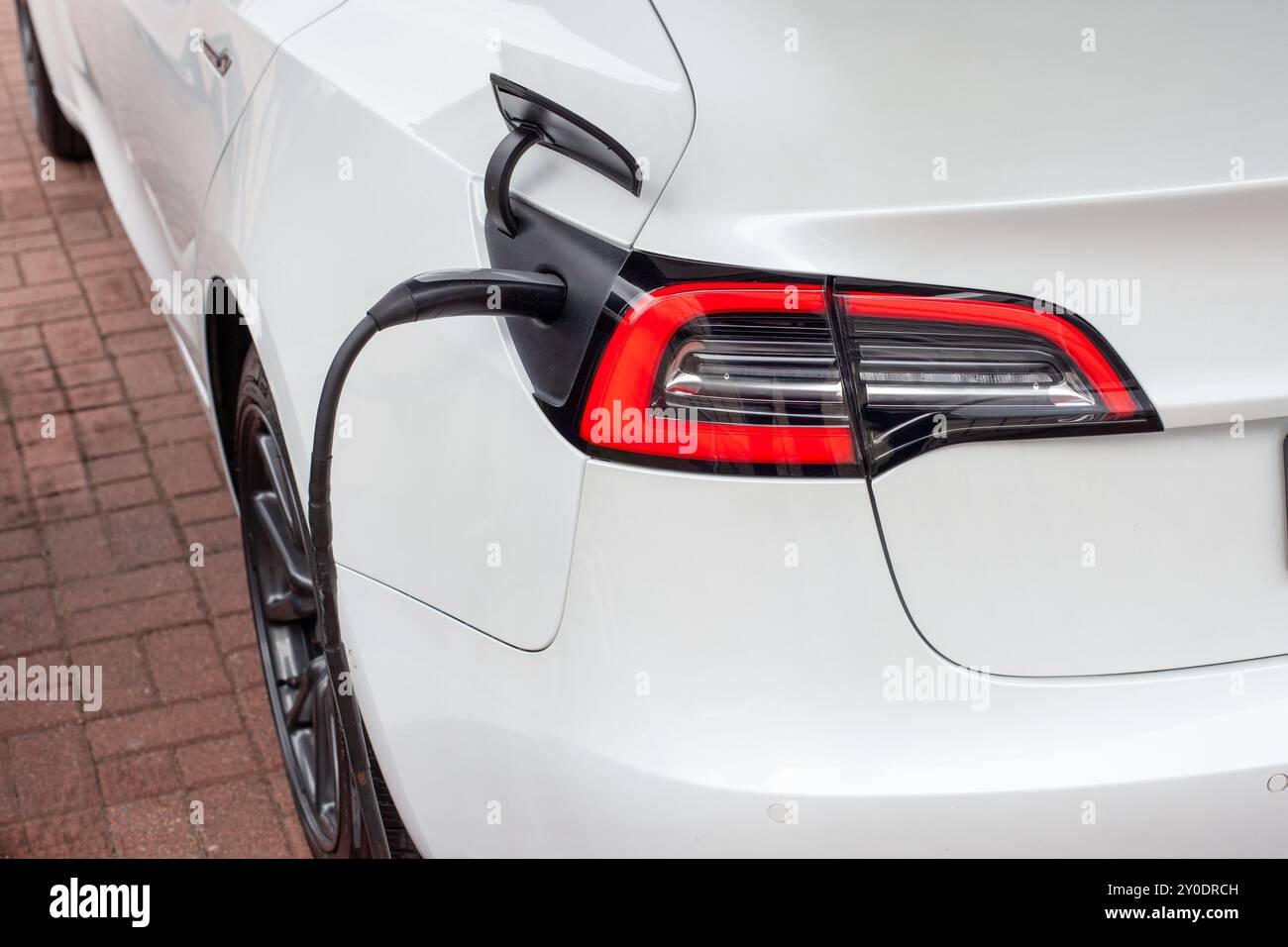 Electric Car Charging Rear View Stock Photo - Alamy