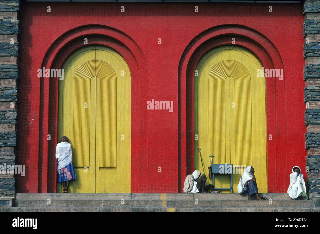 People pray outside doors of Coptic Christian church in Asmara ...