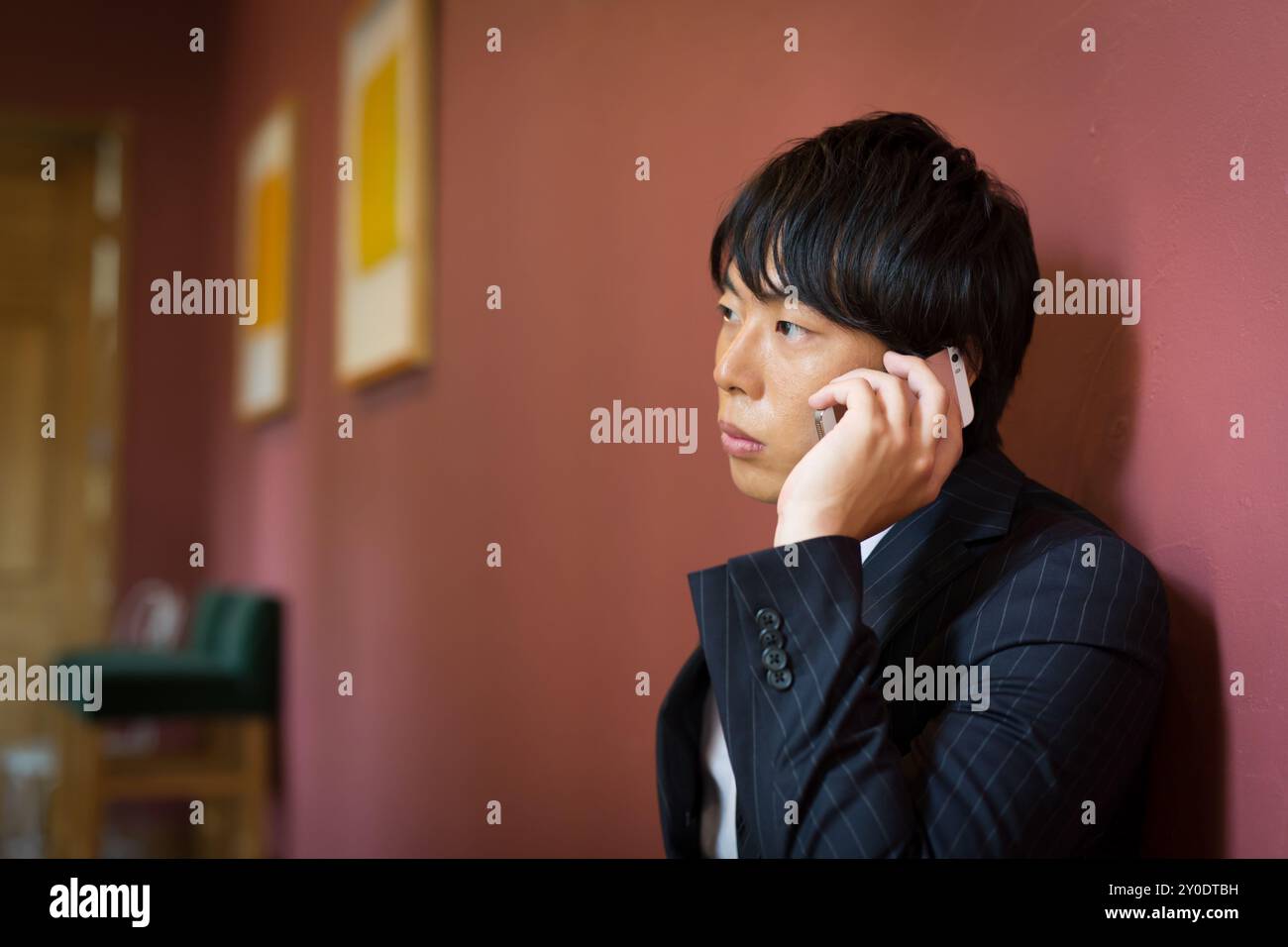 an office worker using cellular phone Stock Photo - Alamy