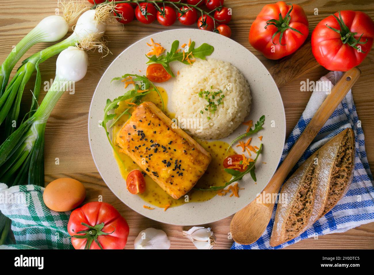 Baked salmon with orange sauce. Top view table with decoration Stock ...
