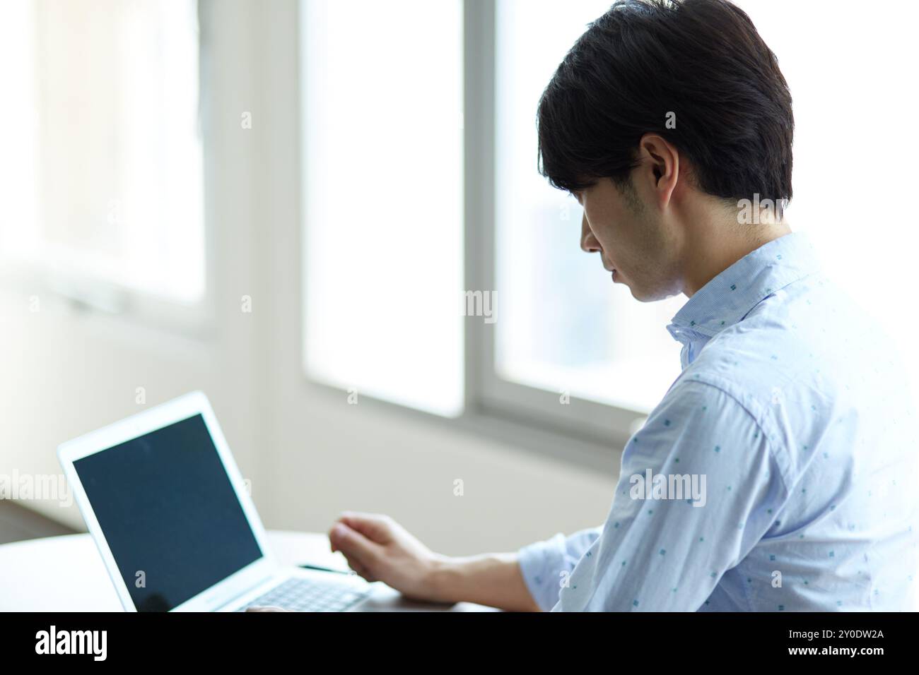 Young man in telework using hi-res stock photography and images - Alamy
