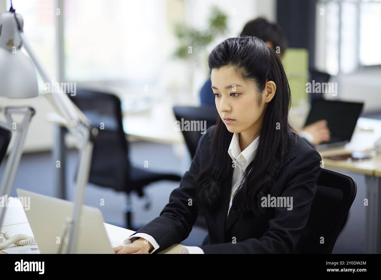 A businesswoman doing deskwork Stock Photo - Alamy