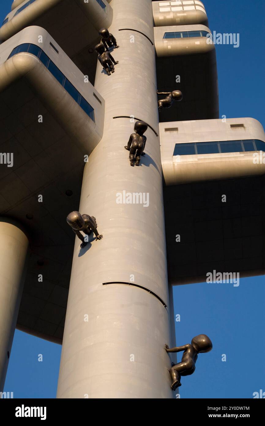 Sculptures of babies crawl on the supports of the Television Tower in ...