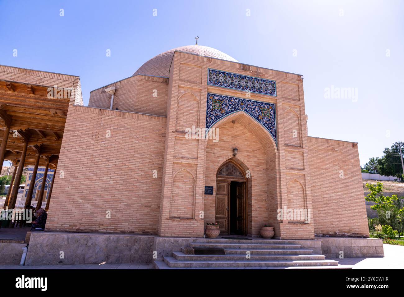 A building with a blue and white tile roof Stock Photo - Alamy