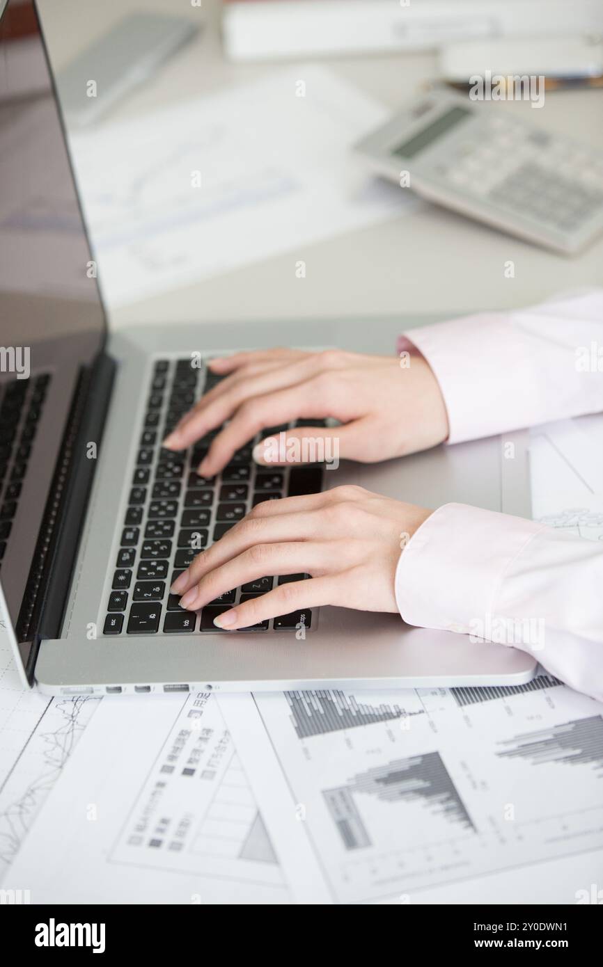 A young business lady hitting computer keyboard Stock Photo - Alamy