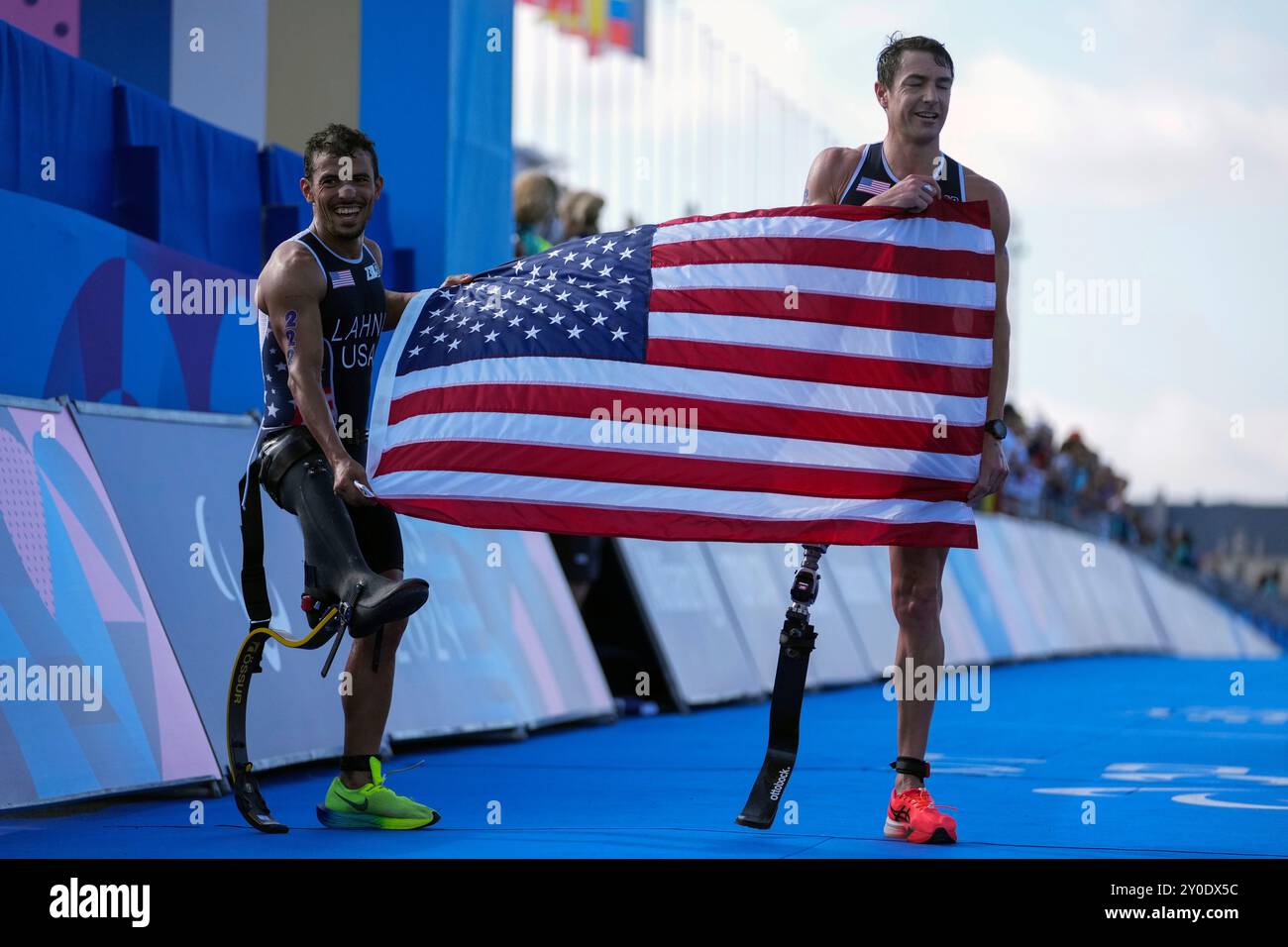Silver medalist Mohamed Lahna, left, and bronze medalist Mark Barr ...