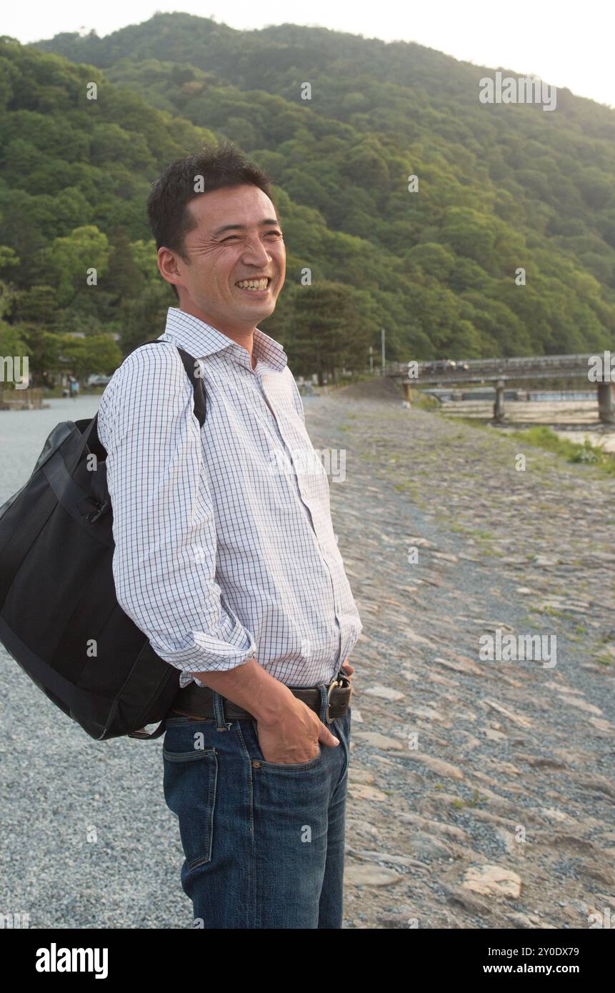 A middle aged man walking in Arashiyama Stock Photo - Alamy