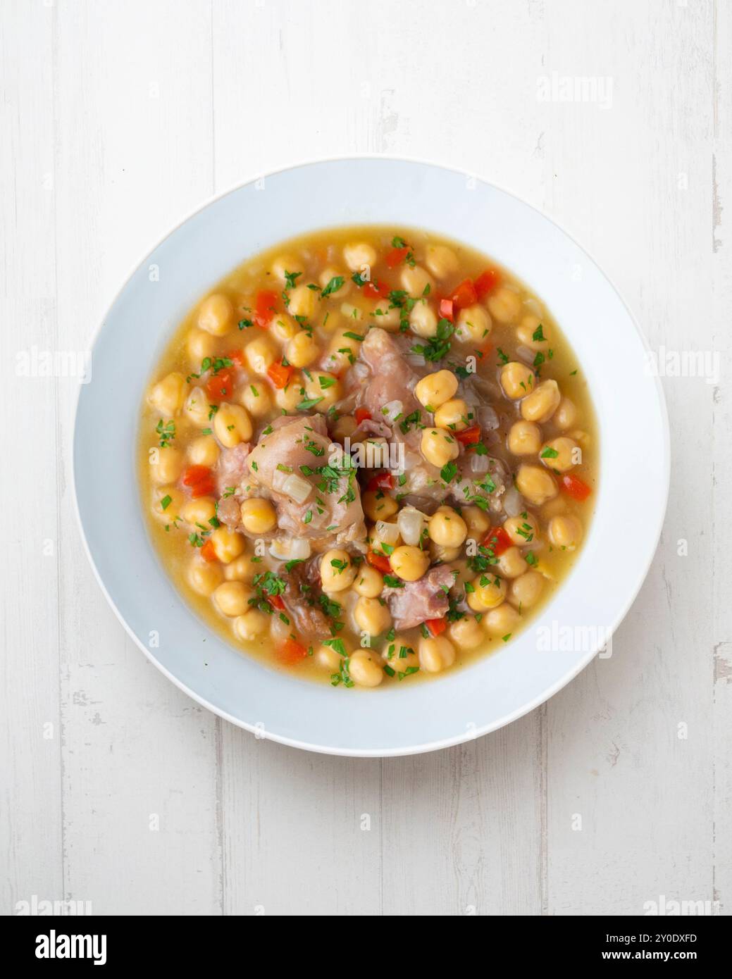 Chickpea stew with pig trotters. Top view table with decorations Stock ...